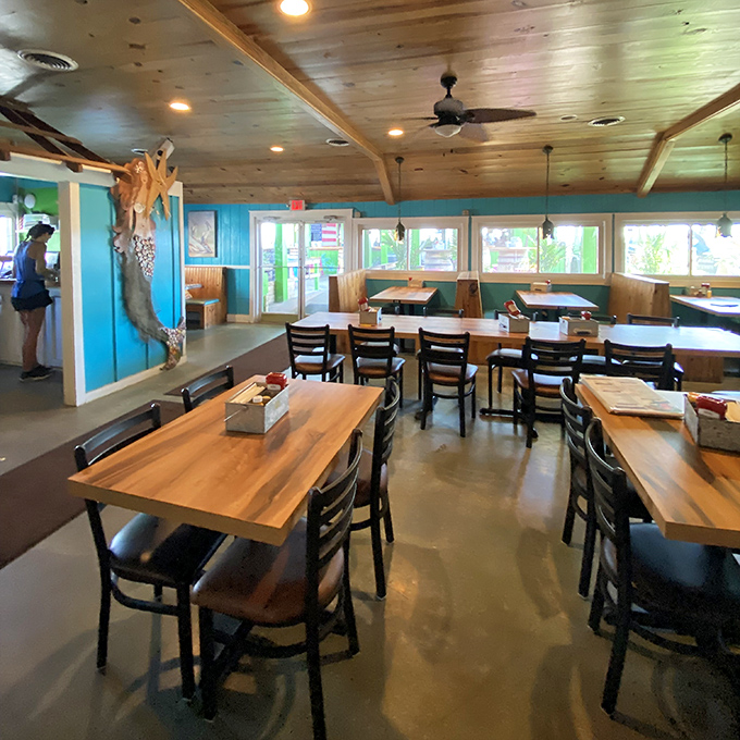 Bright turquoise walls and wooden tables create the perfect backdrop for seafood feasts and vacation-mode decision making.