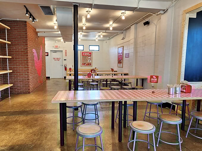 Minimalist industrial charm with maximum flavor potential. The communal tables aren't just furniture—they're friendship incubators over shared chicken experiences.
