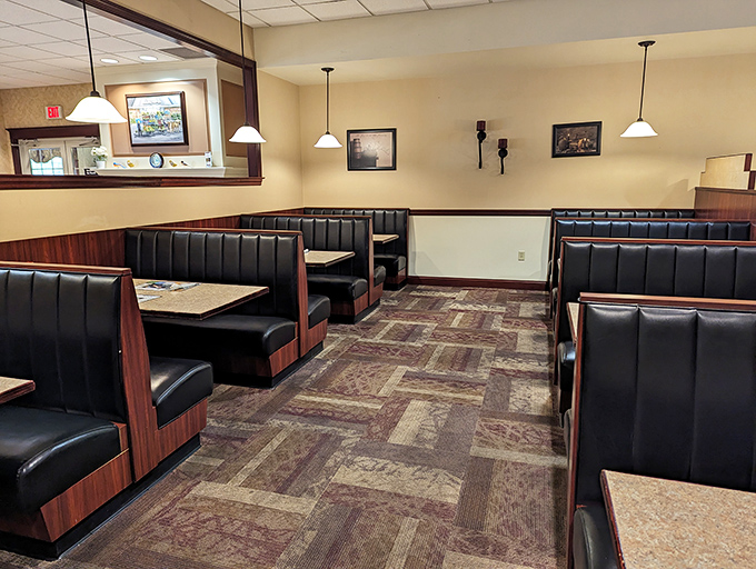 The dining room's cozy booths invite you to settle in and stay awhile—these seats have witnessed countless family celebrations and friendly catch-ups.