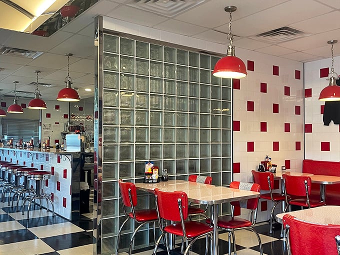 Red and white tiles playing checkers with your nostalgia. Those pendant lights have witnessed more breakfast epiphanies than a Sunday sermon.