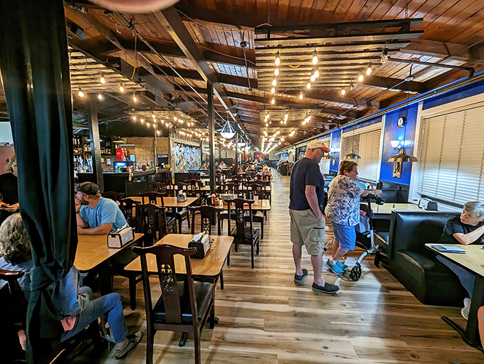 Wooden beams, string lights, and the promise of seafood. The dining room feels like the galley of a particularly delicious pirate ship.