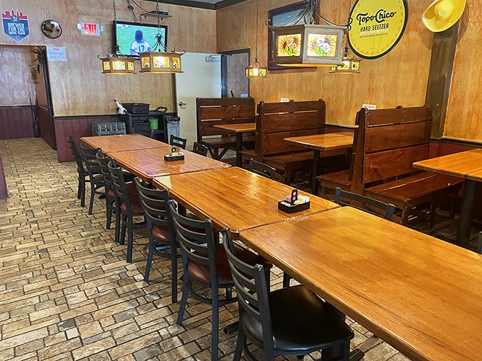 Wooden booths and warm lighting create that "welcome home" feeling. This dining area invites you to settle in and stay awhile.