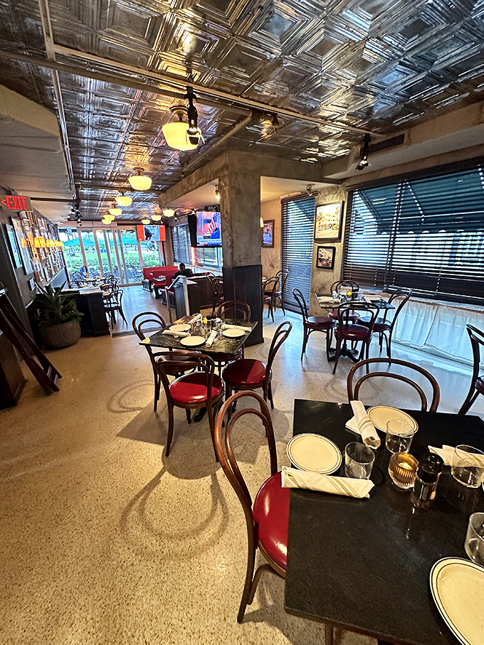 Tin ceilings, bentwood chairs, and that unmistakable bistro energy. The kind of place where conversations flow as easily as the coffee.