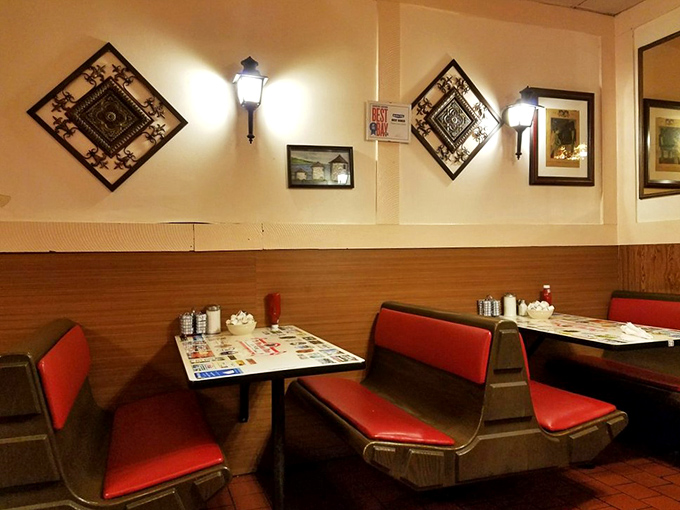 The wall sconces and diamond-patterned art create that perfect diner ambiance—like stepping into a Norman Rockwell painting where calories don't count.