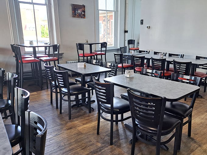 Classic diner seating where calories don't count and conversations flow as freely as the coffee. Red chairs invite you to stay awhile.
