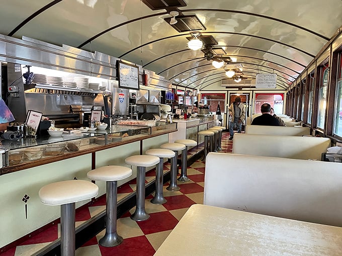 The diner's narrow railcar design isn't just authentic—it's intimate, creating a shared experience where conversations and maple syrup flow with equal ease.