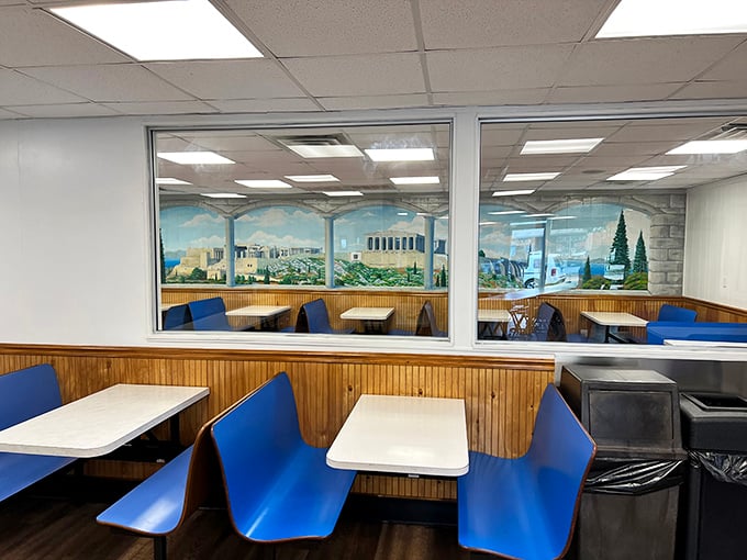 Blue booths and wood paneling—the classic diner aesthetic that says, "Sit down, stay awhile, and forget about your diet for the next hour."