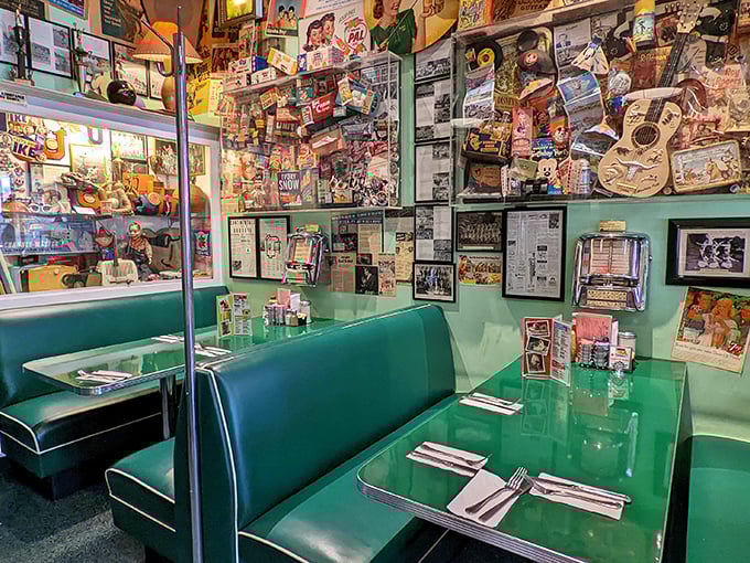 These mint-green booths aren't just seating—they're front-row tickets to the greatest show on earth: people watching with a side of comfort food.