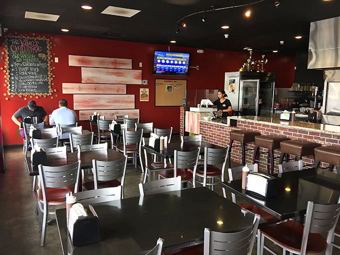 Simple tables, red walls, and the promise of meat. The dining area isn't fancy, but it knows exactly what its priorities are—and so will you.
