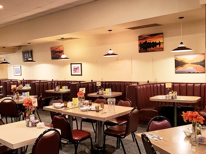 Empty tables waiting for the next rush of hungry travelers. Those landscape photos on the wall? Just appetizers for the real Eastern Sierra views outside.