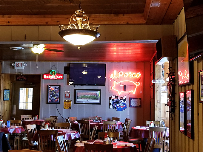 That neon pig sign isn't just decoration—it's a beacon of hope for hungry travelers. The warm glow promises satisfaction just moments away.