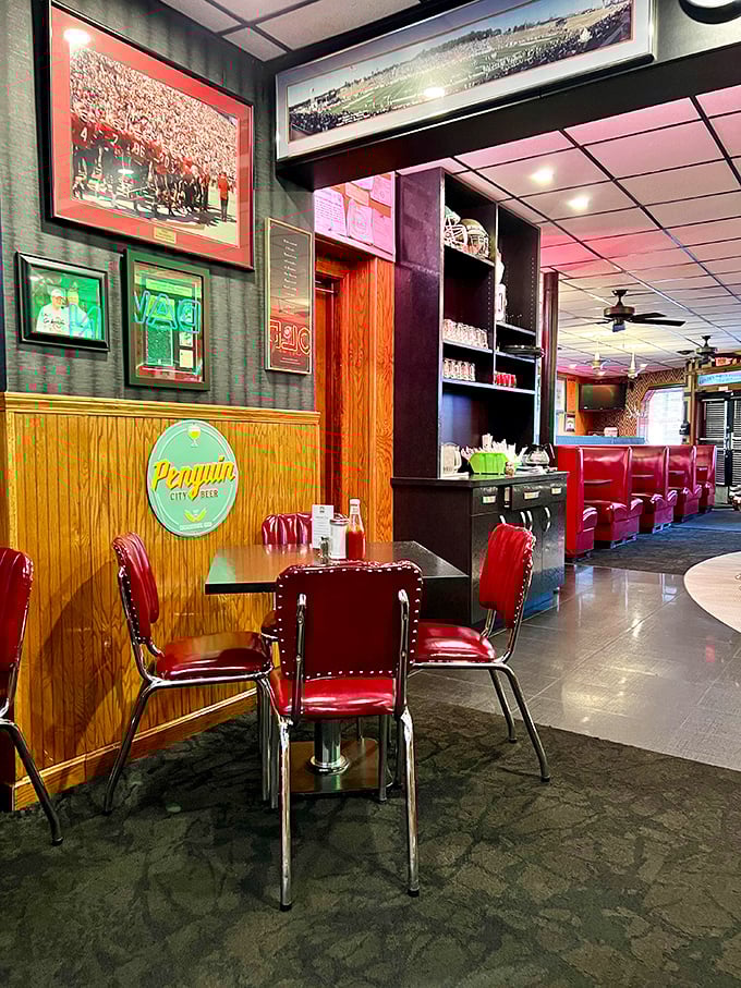 Red vinyl chairs and sports memorabilia create the perfect backdrop for conversations that matter—like whether to order dessert after that sandwich.