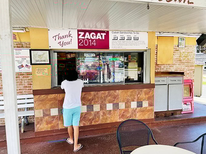 The ordering window, adorned with a Zagat recognition, speaks volumes about this unassuming spot's reputation among those in the know.