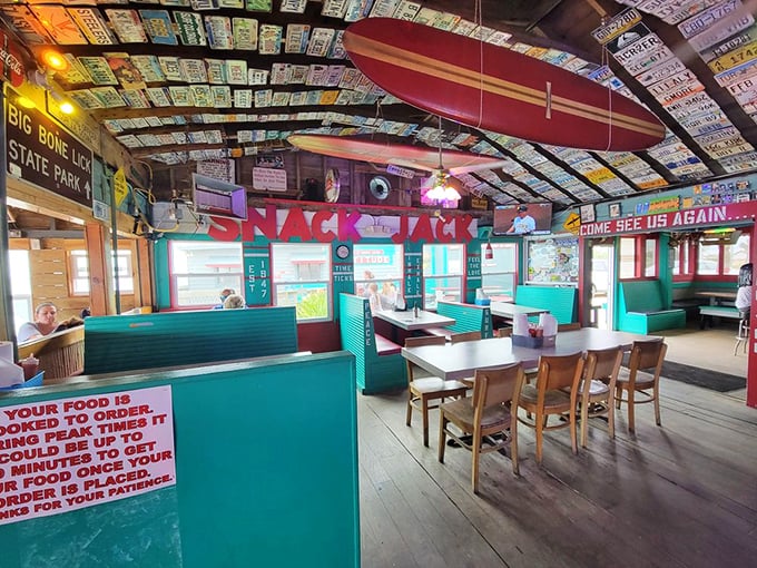 Surfboards hanging from the ceiling, license plates on the walls—this isn't decoration, it's a museum of good times.