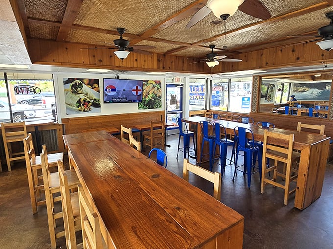 The dining area balances rustic charm with practicality—wooden tables that have hosted thousands of burrito-induced moments of bliss.