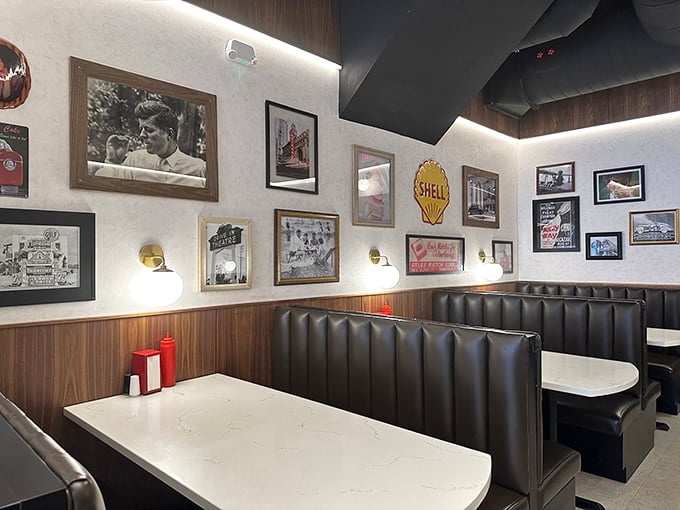Black leather booths and vintage photographs create the perfect backdrop for the main event—your imminent food coma.