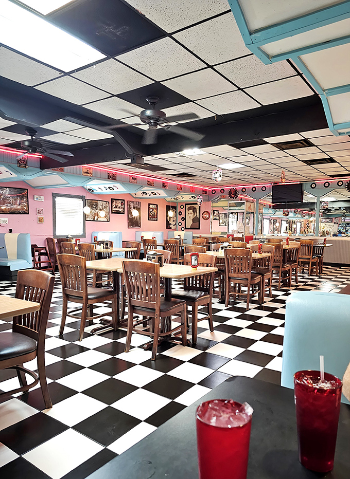 The red drinks pop against the classic black and white floor—a diner where even the color scheme understands the importance of good contrast.