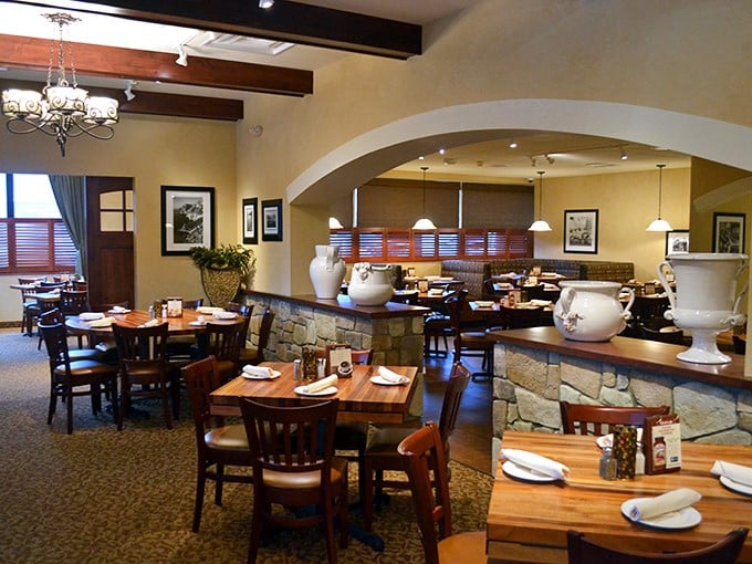 The dining room whispers "stay awhile" with its arched doorways and decorative urns—a stage set for the drama of deciding between tiramisu or cannoli.