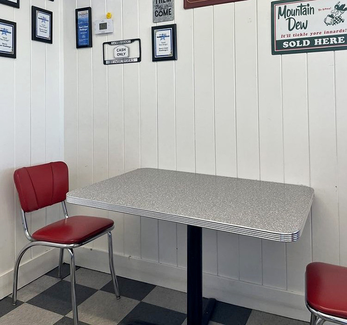 Retro dining perfection with chrome-trimmed tables and red vinyl chairs. Not designed by an Instagram influencer—just authentic since day one.