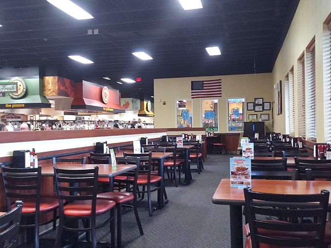 The calm before the feeding storm—empty tables patiently waiting for the parade of plates that will soon occupy every square inch.