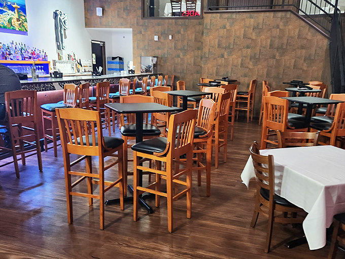 The calm before the carnivorous storm—empty tables patiently waiting for the dinner rush and the inevitable loosening of belts.