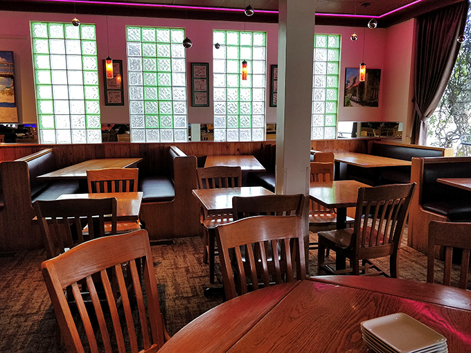 Pink walls and wooden booths create that perfect neighborhood vibe where first dates become anniversaries and strangers become regulars.