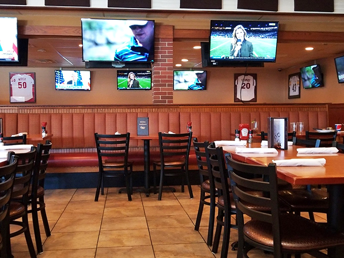 Sports memorabilia meets comfortable seating in a space designed for lingering. Those TVs ensure you won't miss a play while savoring your meal.