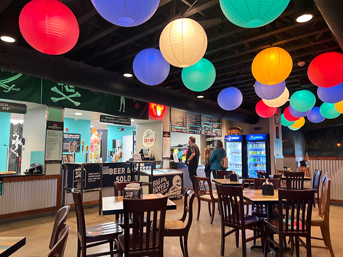 The dining room feels like a carnival for carnivores, where colorful lanterns dance overhead and every table holds the promise of smoky delights.