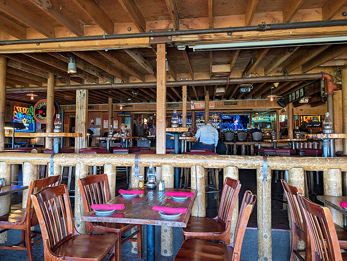 Rustic dining hall where cowboy dreams meet serious eating, complete with twinkling lights and mountain views.
