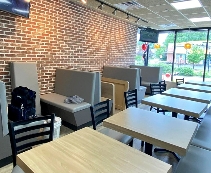 Brick walls and simple booths create the perfect backdrop for the real star of the show—whatever's about to arrive on your plate.