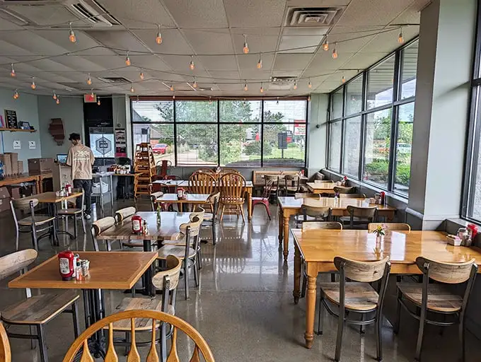 Sunlight floods through windows illuminating a dining room where conversations flow as freely as the coffee refills.