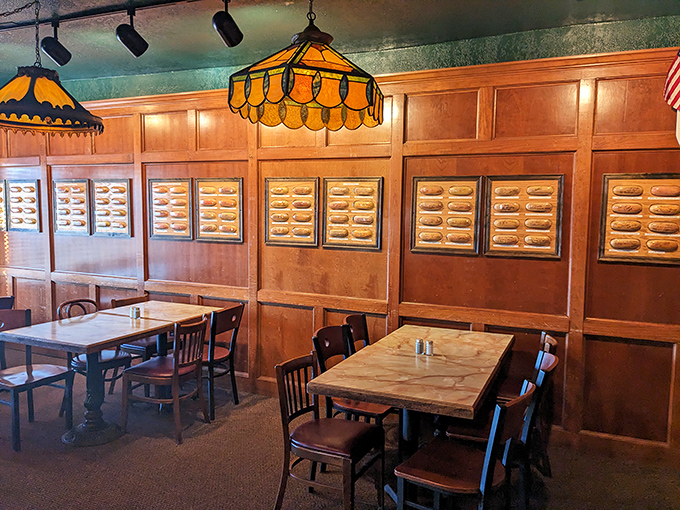 The walls tell stories here—literally. Framed hot dog buns signed by celebrities create a museum-like dining experience where history and hunger happily collide.