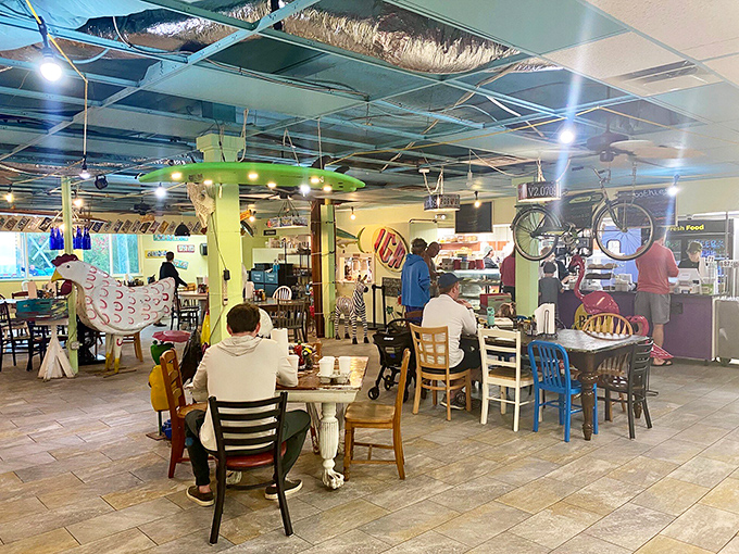 The dining area feels like your most interesting friend's living room—if that friend collected bicycles, chickens, and had an excellent eye for color.