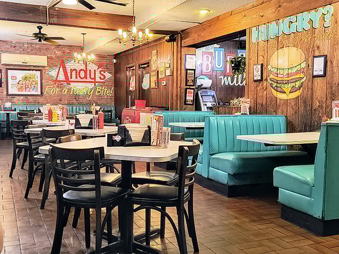 The dining area feels like your favorite aunt's kitchen got an upgrade—comfortable booths, wood paneling, and neon signs that say "calories don't count here."