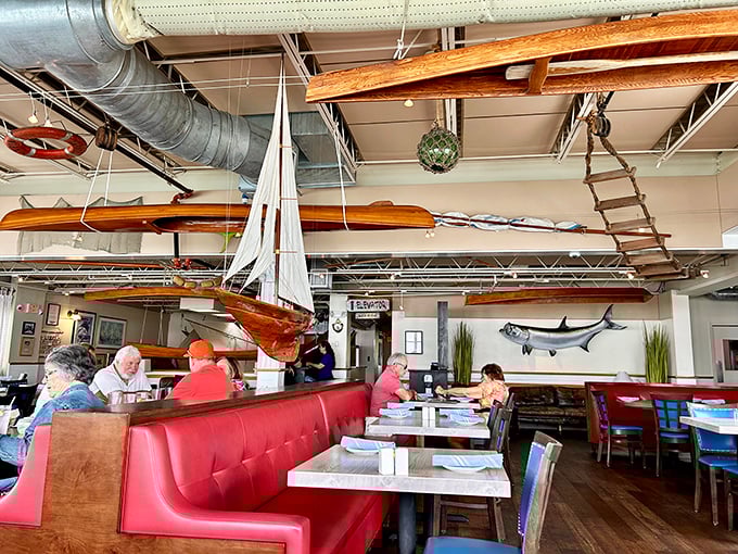 Boats hanging from the ceiling, natural light flooding in, and not a bad seat in the house—this is dining room perfection.