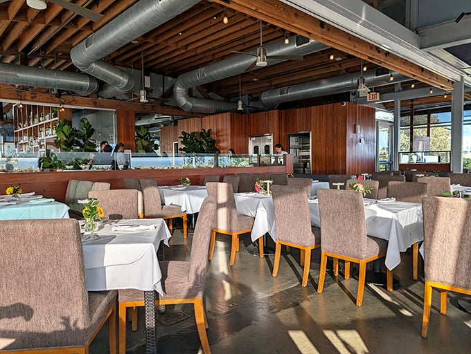 Natural light floods the dining room where every table offers front-row seats to California's endless Pacific panorama.