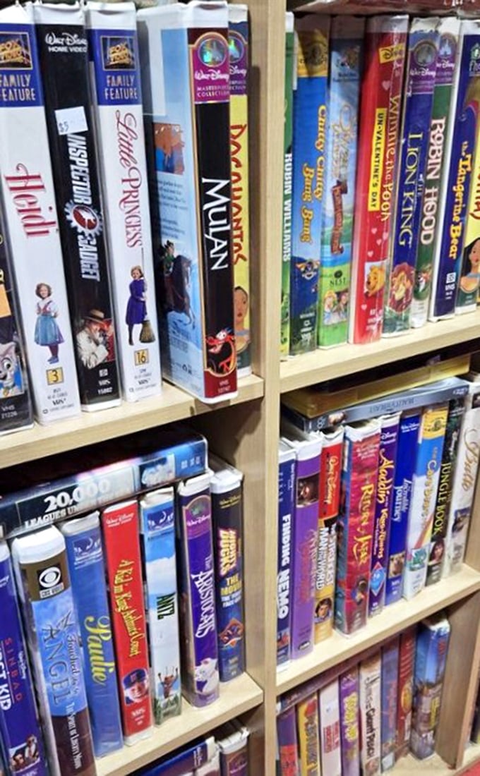 A time capsule of entertainment history lines these shelves – Disney classics in their original VHS glory await nostalgic movie nights.