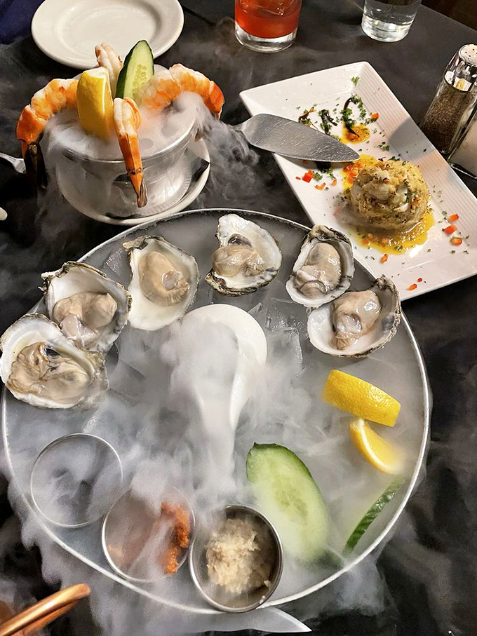 Oysters and shrimp cocktail presented on a bed of dramatic fog—seafood that knows how to make an entrance worthy of Broadway.