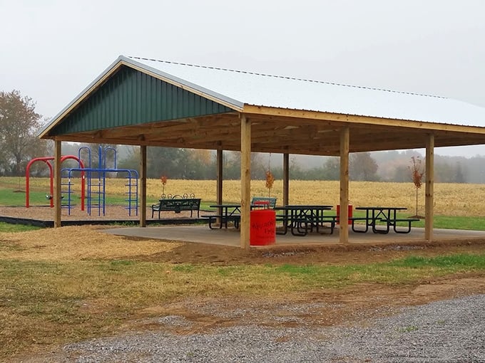 This rustic pavilion offers a shaded respite for weary travelers, proving sometimes the simplest pleasures – like a picnic table – are the most welcome.