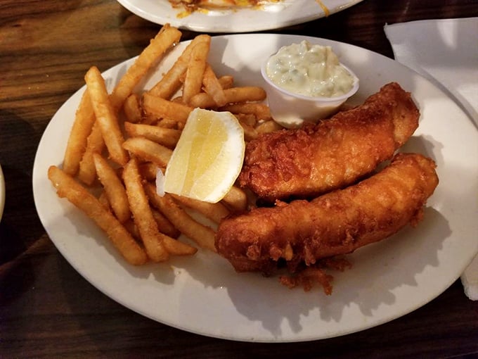 Fish and chips that would make a British pub jealous—crispy exterior giving way to flaky white fish that practically high-fives your taste buds.