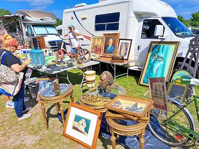 An outdoor gallery where forgotten portraits find new admirers. That red bicycle might just be your next conversation piece.