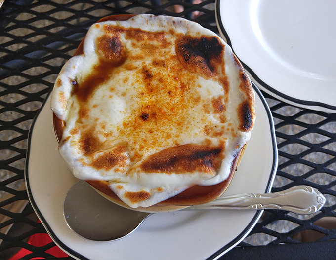 French onion soup with a cheese cap so perfectly browned it deserves its own Instagram account. This isn't just soup—it's comfort in a crock.