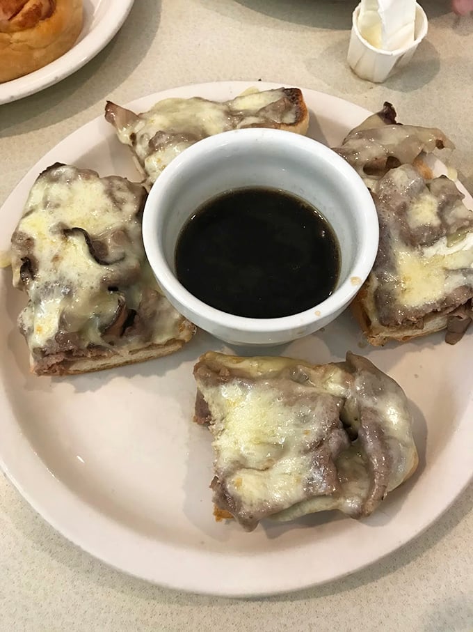 These open-faced sandwiches with melted cheese and au jus aren't just food—they're a warm hug on a plate.