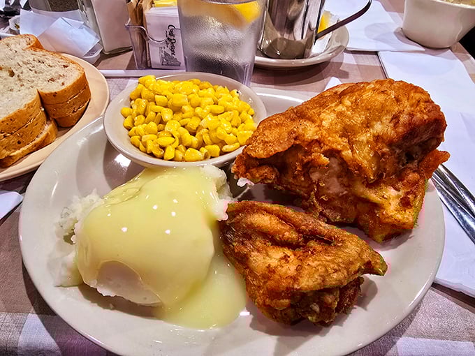 Fried chicken with that golden-ratio coating—crispy enough to hear it, tender enough to dream about it. Those sides aren't playing backup; they're co-stars.