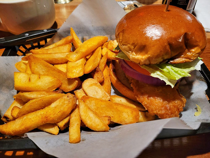Sandwich architecture at its finest. This towering fried fish creation demands both hands and your complete attention—worth every delicious bite.