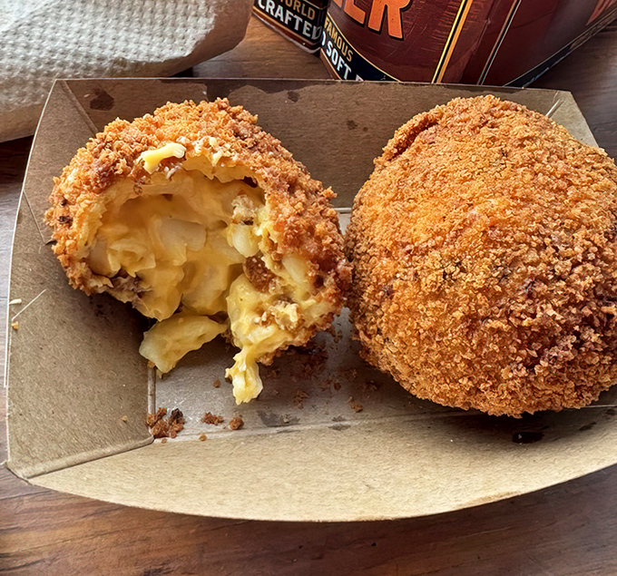 Fried mac and cheese balls with brisket inside—because sometimes one comfort food just isn't enough. Crispy outside, molten goodness within.
