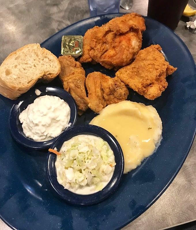 Fried chicken with that perfect golden crust—crispy on the outside, juicy on the inside—served with sides that would make any Southern grandmother nod in approval. 