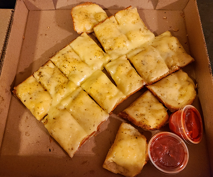 Garlic cheese bread: the supporting actor that often steals the show. Golden, gooey, and guaranteed to ruin your breath in the best way.