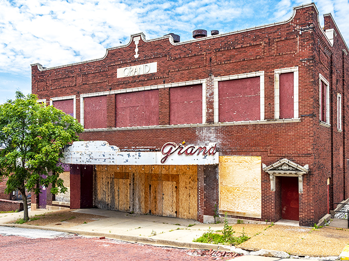 The Grand Theatre's boarded-up façade tells stories of Saturday matinees and first dates—a sleeping beauty waiting for someone to break the spell.