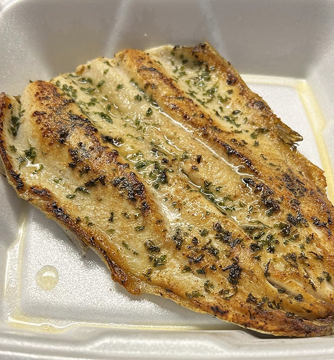 Perfectly grilled fish that glistens with herb-infused butter. Simple preparation that lets quality speak for itself—and it's saying all the right things.